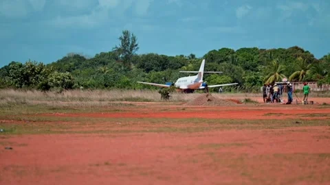 Airplane on a dirt runway out in the bus... | Stock Video | Pond5