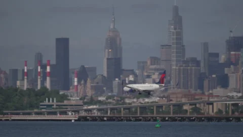 Airplane landing flying into New York Ci... | Stock Video | Pond5