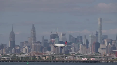 Airplane landing flying into New York Ci... | Stock Video | Pond5