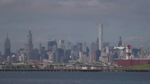 Airplane landing flying into New York Ci... | Stock Video | Pond5