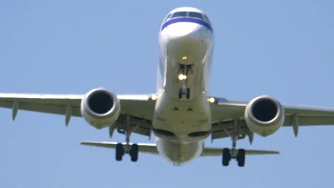 Airplane landing overhead in 4k slow mot... | Stock Video | Pond5