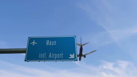 airplane passing over maun airport sign | Stock Video | Pond5