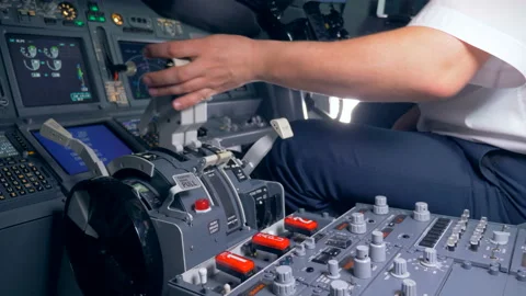 Airplane pilot pushes buttons and switch... | Stock Video | Pond5