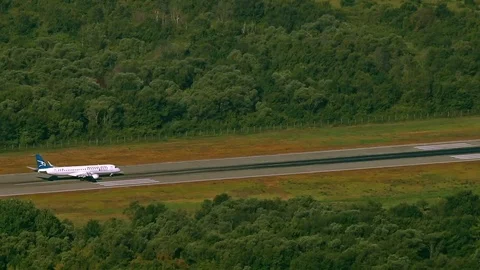 Airplane traffic on runway and takeoff f... | Stock Video | Pond5