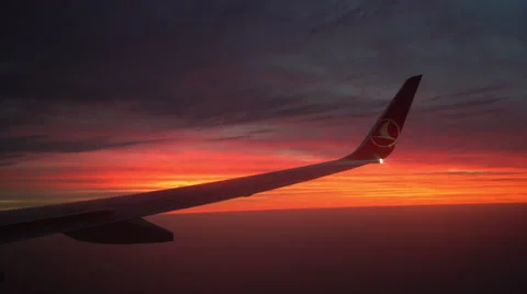Airplane wing at tropical sunset - view ... | Stock Video | Pond5