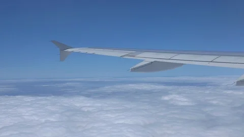 Airplane wings floating above the clouds... | Stock Video | Pond5