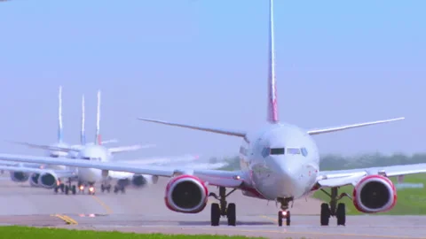 Airplanes in queue on the runway. Standi... | Stock Video | Pond5