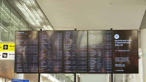 Airport information board in the departu... | Stock Video | Pond5