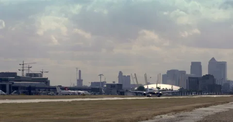 Airport Passenger Jet takes off with cit... | Stock Video | Pond5