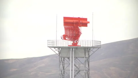 Airport radar tower, medium. Red rotatin... | Stock Video | Pond5