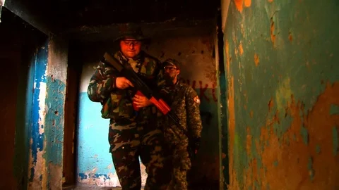 Airsoft game on background of ruined bui... | Stock Video | Pond5