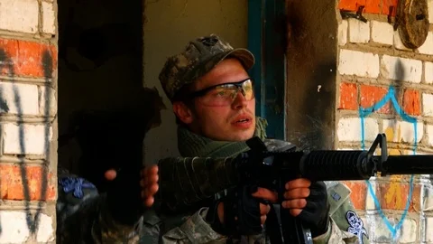 Airsoft game on background of ruined bui... | Stock Video | Pond5