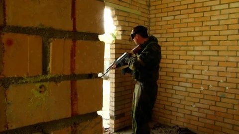 Airsoft game on background of ruined bui... | Stock Video | Pond5