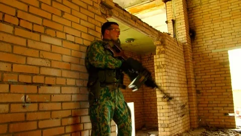 Airsoft game on background of ruined bui... | Stock Video | Pond5