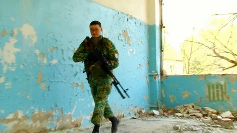 Airsoft game on background of ruined bui... | Stock Video | Pond5