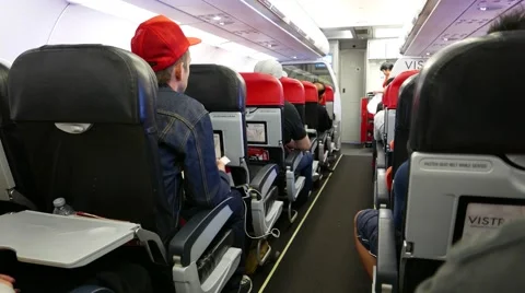 Aisle of airplane in flight, loud speake... | Stock Video | Pond5