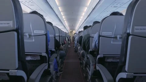 the aisle pathway inside plane cabin wit... | Stock Video | Pond5