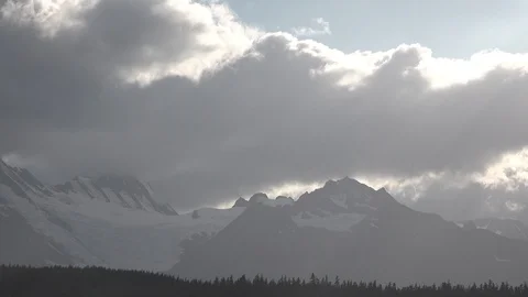Alaska. The sun illuminates the peaks of... | Stock Video | Pond5