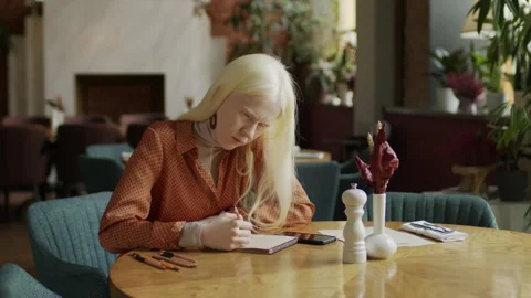 Albino Girl Drawing Something In Sketchb... | Stock Video | Pond5