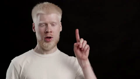 Albino Man Pointing Finger Up Having Ide... | Stock Video | Pond5