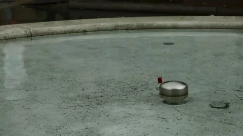 Alcohol bottle floating in a fountain ba... | Stock Video | Pond5
