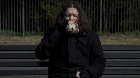 Alcoholic drinking liquor on a park benc... | Stock Video | Pond5