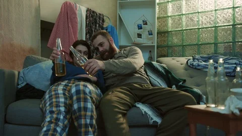 Alcoholic young poor couple drink beer s... | Stock Video | Pond5