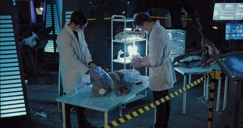 Alien connected to a respirator, lying o... | Stock Video | Pond5