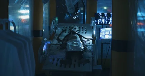 Alien lies in the operating room under o... | Stock Video | Pond5