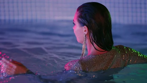Alluring woman dancing in swimming pool ... | Stock Video | Pond5