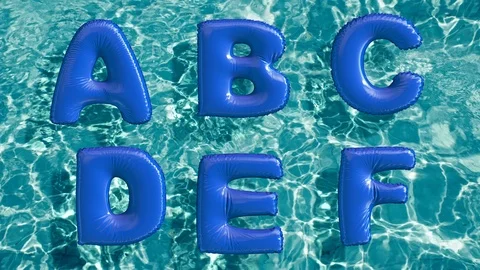 alphabet made of shaped inflatable swim ... | Stock Video | Pond5