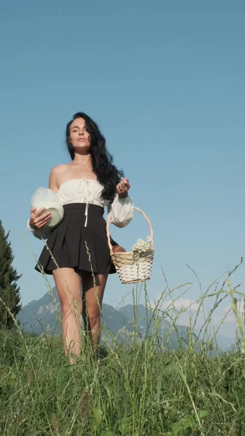 Alpine country girl with bottle of milk.... | Stock Video | Pond5