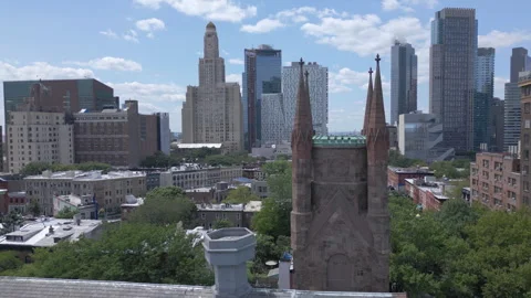 alt flying counter clockwise around chur... | Stock Video | Pond5