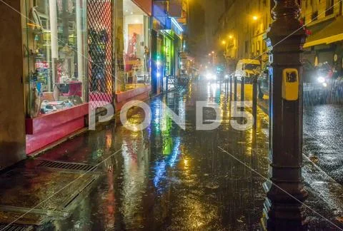 Amazing night view in autumn in rain in Paris in wet asphalt and street ...