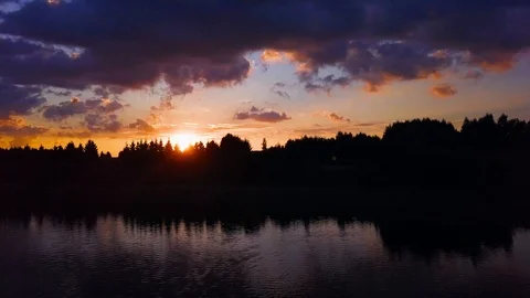Amazing sunset on a lake. Beautiful colo... | Stock Video | Pond5