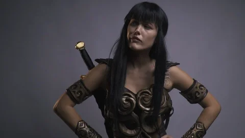 Amazon in armor with a sword and a battl... | Stock Video | Pond5