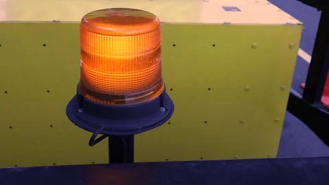 An amber warning light equipped with a r... | Stock Video | Pond5