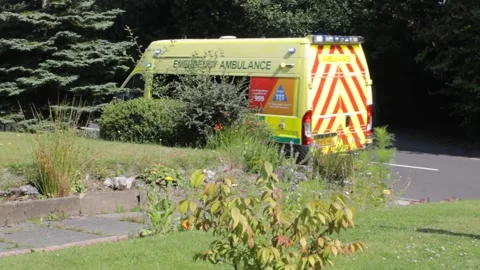 Ambulance slowly pulling off and driving... | Stock Video | Pond5