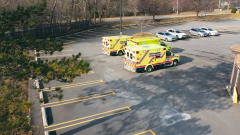 Ambulance vehicles on car parking of eme... | Stock Video | Pond5