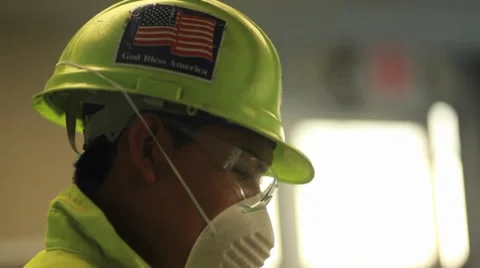 An American factory worker wears a helme... | Stock Video | Pond5