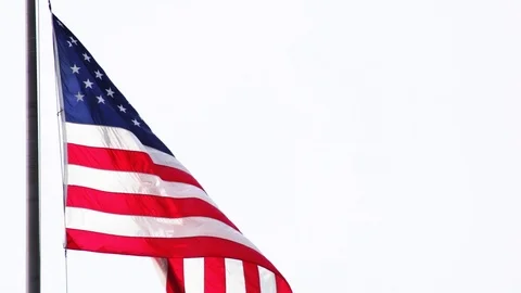 An American flag on a pole flowing in th... | Stock Video | Pond5