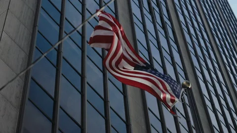 American flag waving on the building in ... | Stock Video | Pond5