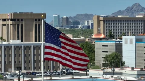 American flag waving in front of Phoenix... | Stock Video | Pond5
