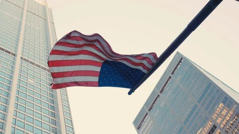 American flag waving on a skyscraper bui... | Stock Video | Pond5