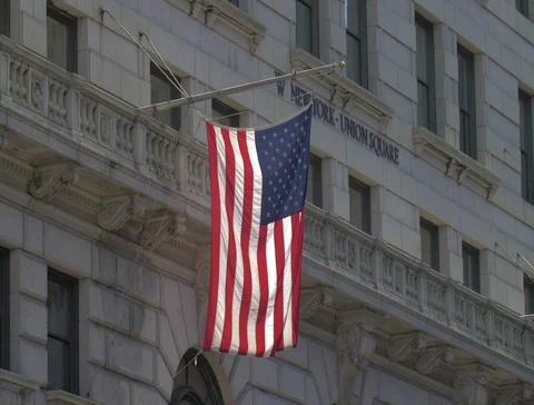 American Flag waving on union square bui... | Stock Video | Pond5