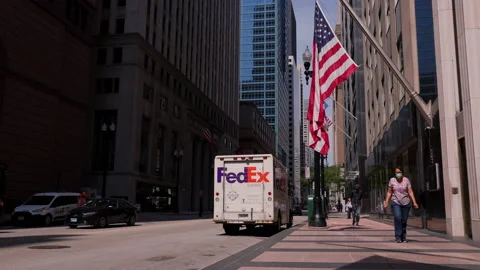 American Flags and Fedex truck deliverin... | Stock Video | Pond5
