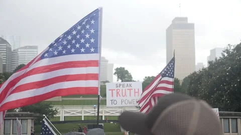 American flags at a No Kings protest on ... | Stock Video | Pond5