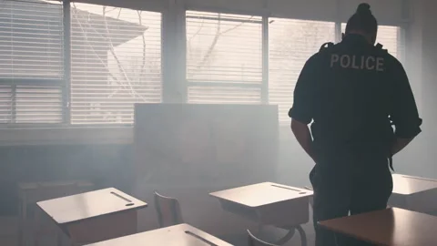 American police officer in a class room ... | Stock Video | Pond5