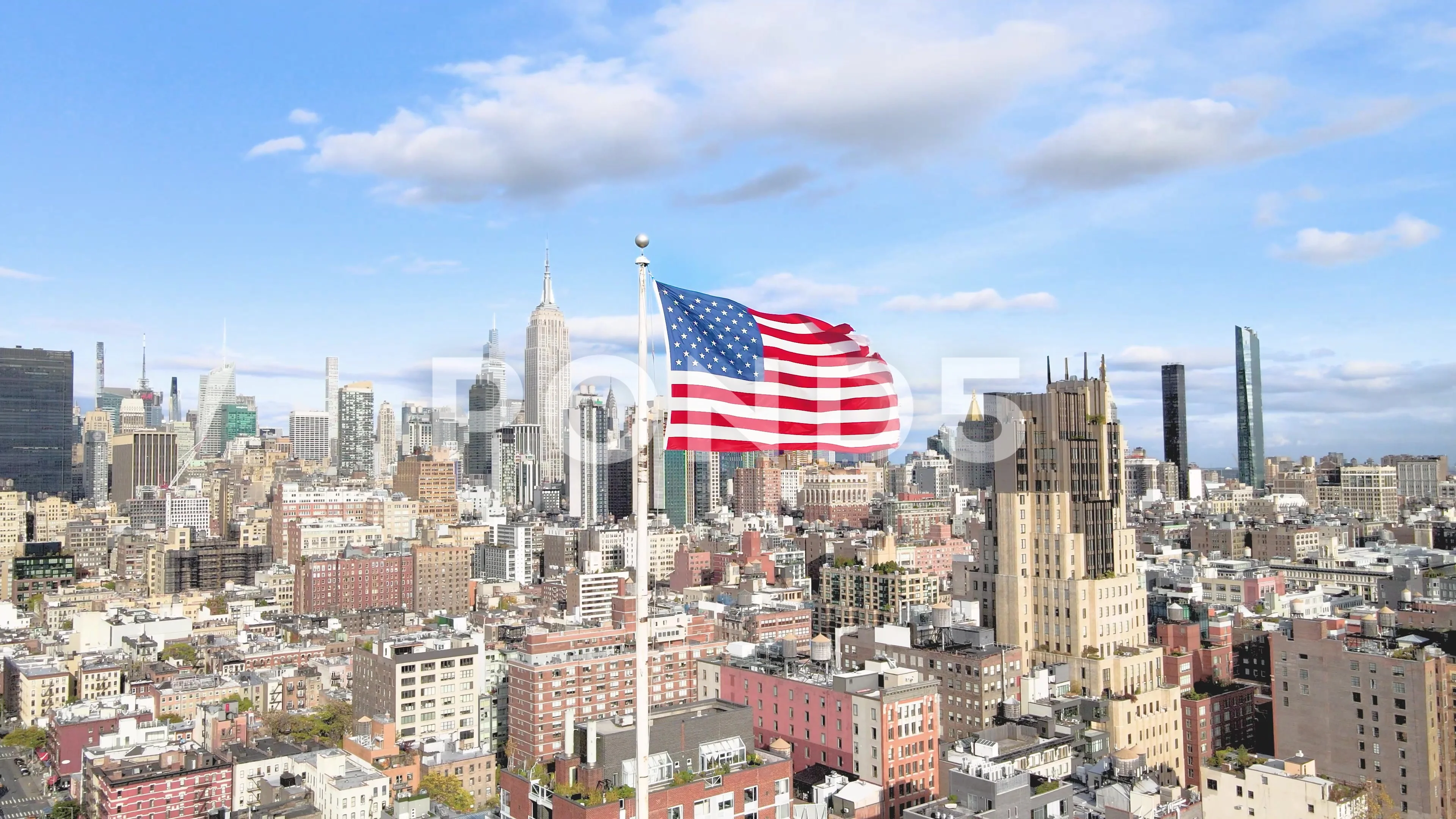 American Flag Over City