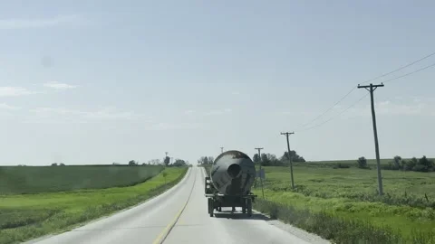 Amish cart transporting a grain bin | Stock Video | Pond5